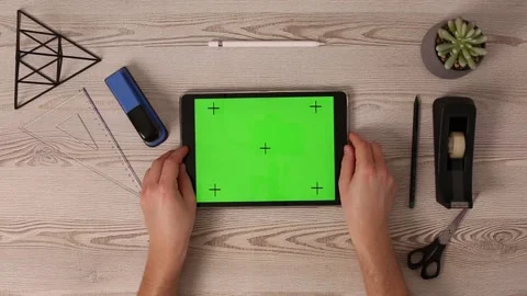 Top-Down View, Male hands put Green Scre... | Stock Video | Pond5