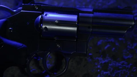 top down view of revolver gun on crime s... | Stock Video | Pond5