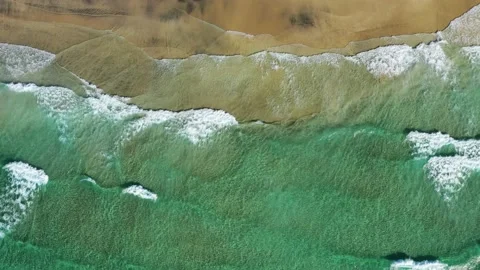 Top down View on the sand Beach with Spl... | Stock Video | Pond5