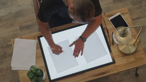 Top Down View of a Sketch Artist Drawing... | Stock Video | Pond5