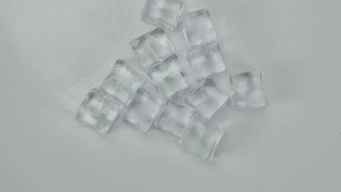 Top down view of wet ice cubes rotating ... | Stock Video | Pond5