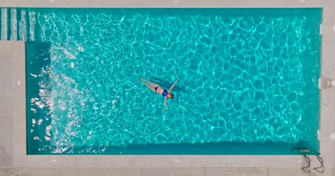Top down view of a woman in blue swimsui... | Stock Video | Pond5