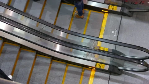 Top shot of people taking the escalator ... | Stock Video | Pond5