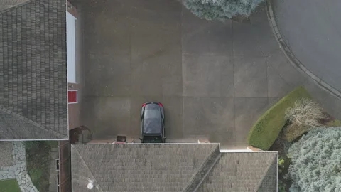 Top view aerial of black car backing up ... | Stock Video | Pond5