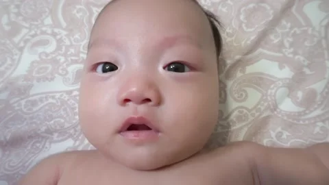 Top view of baby boy head look up | Stock Video | Pond5