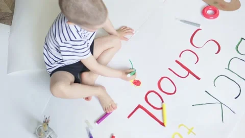 top view baby child kid boy coloring dra... | Stock Video | Pond5