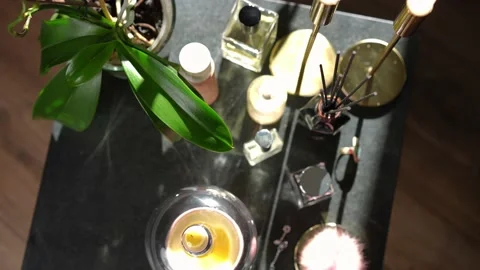Top view black table with perfumes candl... | Stock Video | Pond5