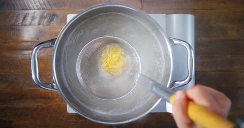 Top View Boiling Noodles in Water and Oi... | Stock Video | Pond5