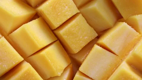 Top view of bright yellow cube sliced fr... | Stock Video | Pond5