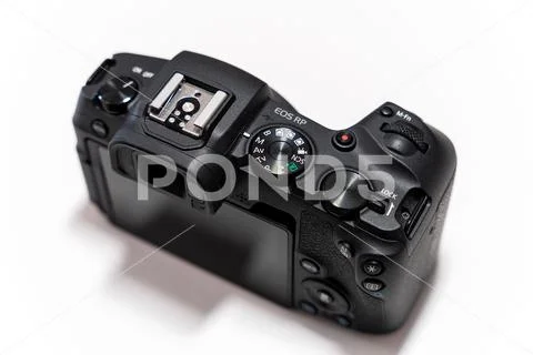 Photograph: Top view of a Canon EOS RP camera on a white background ...
