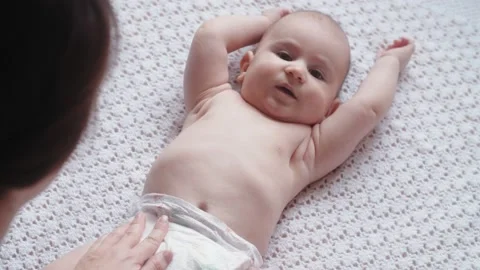 Top view, caring loving mom changing dia... | Stock Video | Pond5