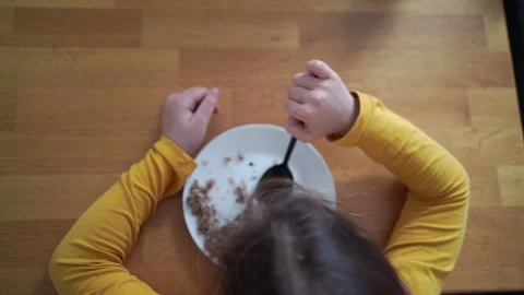 Top view of a child eating breakfast cer... | Stock Video | Pond5