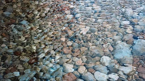Top view of a clear wavy river with pebb... | Stock Video | Pond5