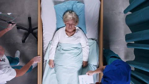 Top view of doctors pushing patient in b... | Stock Video | Pond5