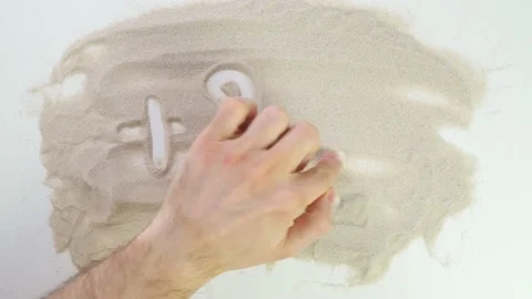 Top view draw on the sand. Caucasian han... | Stock Video | Pond5