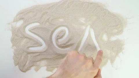 Top view draw on the sand. Caucasian han... | Stock Video | Pond5