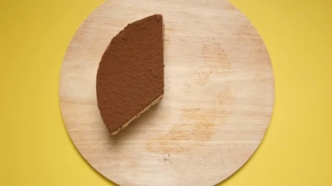 TOP VIEW: Eating a layer cake on a yello... | Stock Video | Pond5