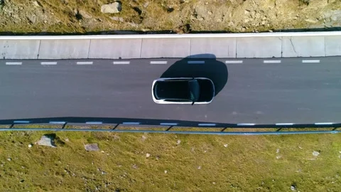Top view of electric car driving on the ... | Stock Video | Pond5