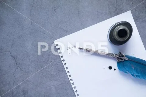 Top view of empty paper, fountain pen and ink on black background Stock ...
