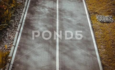 Top view of empty road texture with straight lines in white line on ...