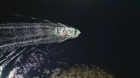 Top view, A fishing motor boat sails int... | Stock Video | Pond5