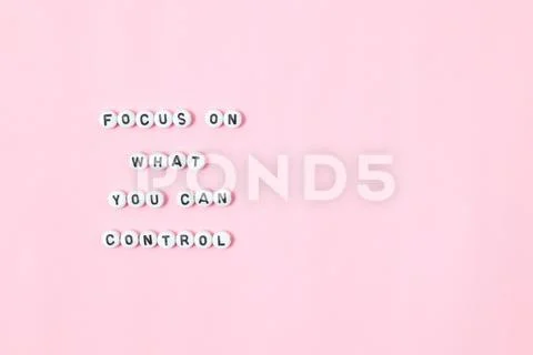 Top view of "focus on what you can control" quotes made out of beads on ...