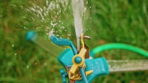 Top view of garden sprinkler mounted on ... | Stock Video | Pond5