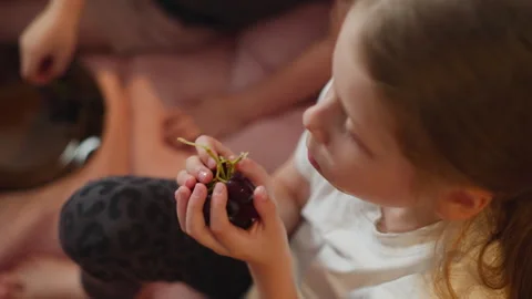 Top View Girl Eating Grape Branch While ... | Stock Video | Pond5