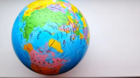 Top view of the globe rotation on a whit... | Stock Video | Pond5