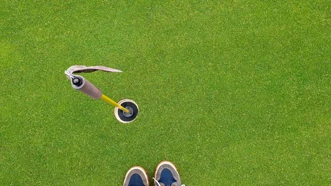 Top view of a golf course - hole with a ... | Stock Video | Pond5