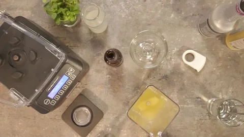 Top view of hand pouring ice cubes to bl... | Stock Video | Pond5