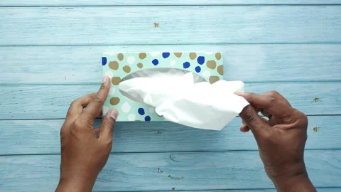 top view of hand pull out a piece of tis... | Stock Video | Pond5