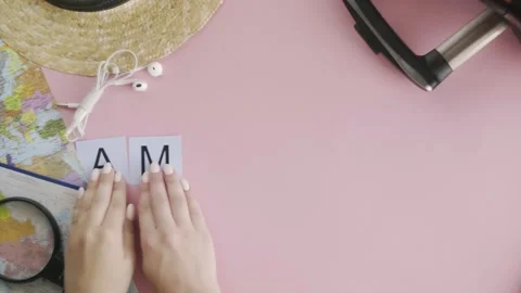 Top view hands laying on pink desk word ... | Stock Video | Pond5