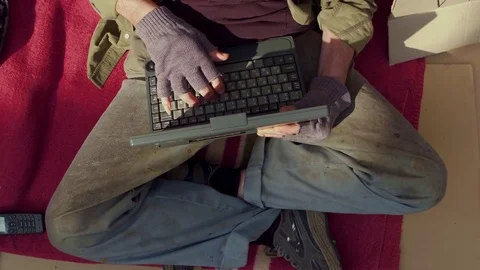 Top view of homeless man typing on lapto... | Stock Video | Pond5