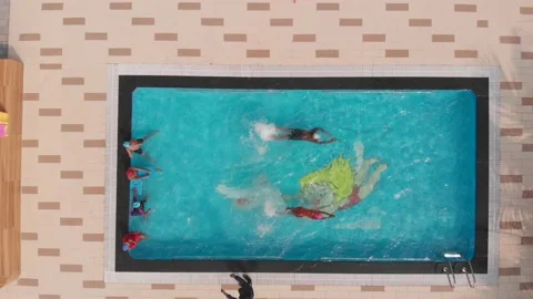 top view of kids shallow pool with kids ... | Stock Video | Pond5