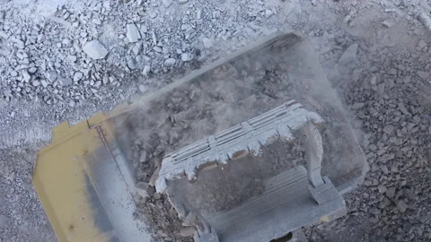 Top view loading into a huge mining dump... | Stock Video | Pond5