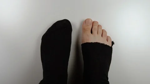 TOP VIEW: Male legs with Socks with a ho... | Stock Video | Pond5