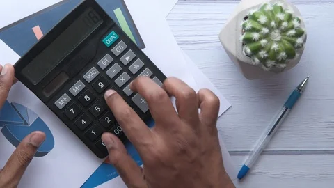 top view of man hand use calculator on o... | Stock Video | Pond5