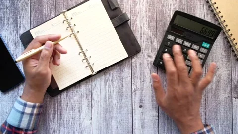 top view of man hand using calculator | Stock Video | Pond5