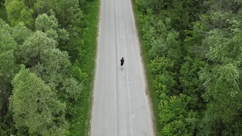 Top View Of A Man Running Across The Emp... | Stock Video | Pond5