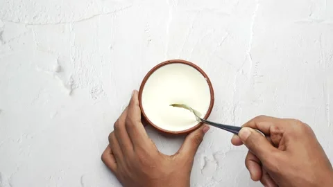 Top view of man's hand eating fresh yogu... | Stock Video | Pond5