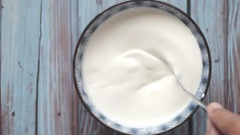 top view of milk cream in a container on... | Stock Video | Pond5