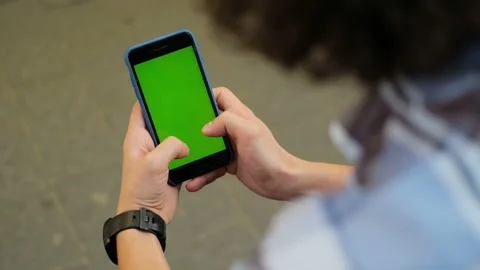 Top view of mobile phone with green scre... | Stock Video | Pond5