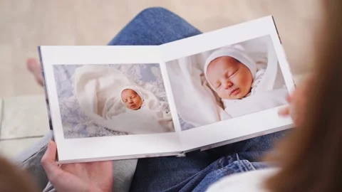 top view. mother and daughter watch phot... | Stock Video | Pond5
