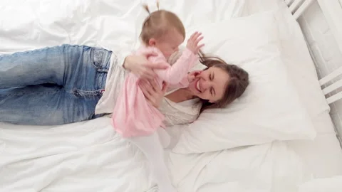 Top view Mother and little daughter tick... | Stock Video | Pond5