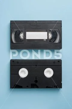 Top view of old VHS video tape on blue background Stock Photo #302785885