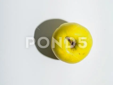 Photograph: Top view of organic green apple isolated on white ...