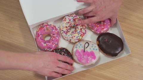 Top view like people take donuts out of ... | Stock Video | Pond5