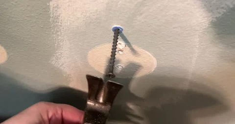 Top view pulling anchor from wall using ... | Stock Video | Pond5