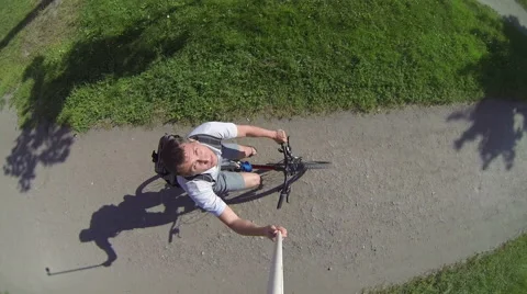 Top view of riding bicycle on park pathw... | Stock Video | Pond5